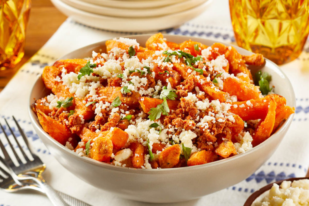 Baked Sweet Potato Fries with Chorizo, Cotija & Garlic | Cacique® Inc.